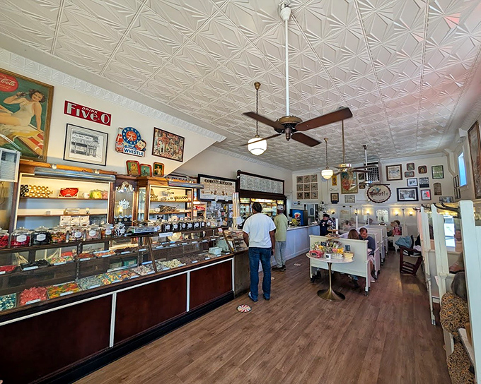 Step inside and breathe in a century of confectionery history. The pressed tin ceiling and vintage display cases tell stories sweeter than any dessert menu.