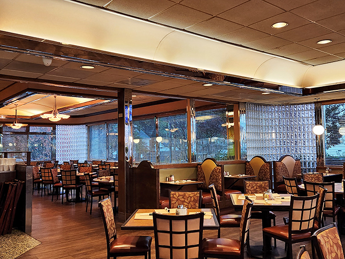 Inside, warm wood tones and comfortable booths create that perfect diner atmosphere where conversations flow as freely as the coffee.