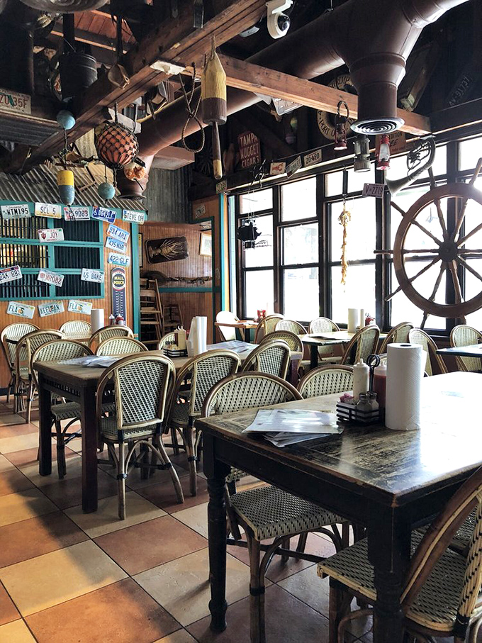 Nautical treasures dangle from every beam, creating the perfect atmosphere for seafood consumption. Like dining inside a charming captain's quarters without the seasickness.