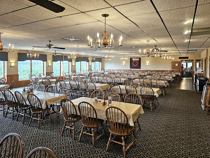 Wooden Windsor chairs and simple tablecloths set the stage for culinary drama in a dining room that whispers "come, sit, stay awhile."