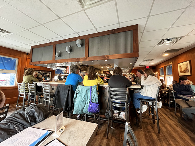 Inside J's, the horseshoe bar isn't just furniture&mdash;it's the stage where seafood dreams come true, as locals and visitors huddle over treasures from the deep.