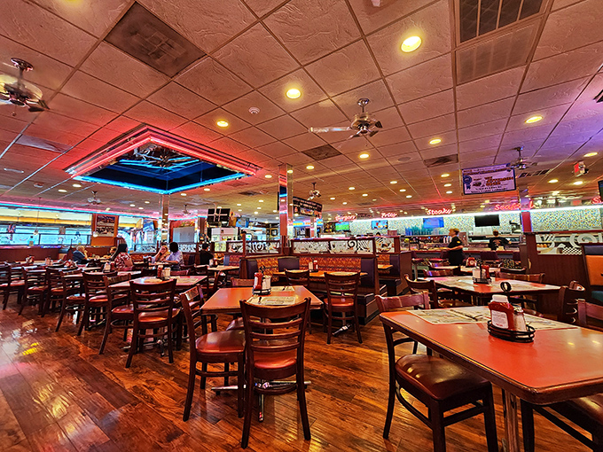 Inside, neon lights cast a warm glow over wooden floors and comfortable booths. This isn't Instagram-manufactured nostalgia&mdash;it's the real deal.