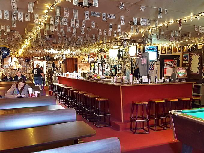 Dollar bills papering the ceiling and walls tell stories of satisfied customers who've made the pilgrimage to this barbecue sanctuary.