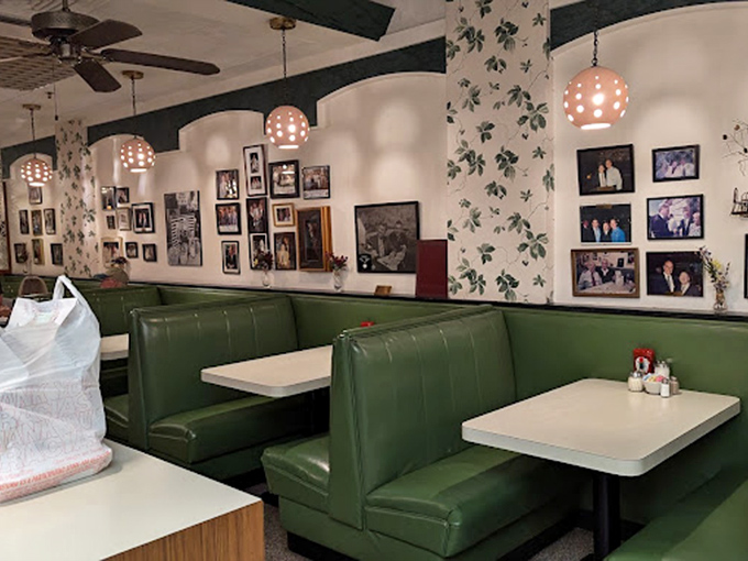 Green vinyl booths and family photos create the perfect time capsule where memories are made between bites of legendary pasta.