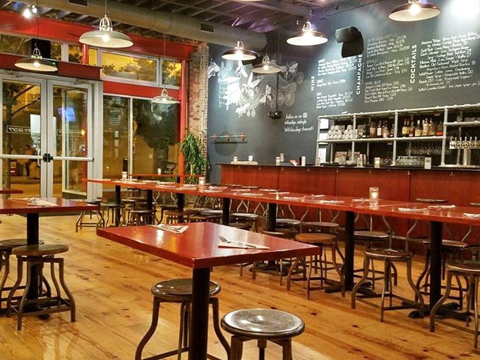 Industrial-chic meets Southern comfort in this warm interior where wooden communal tables invite strangers to become friends over plates of honey-drizzled perfection.