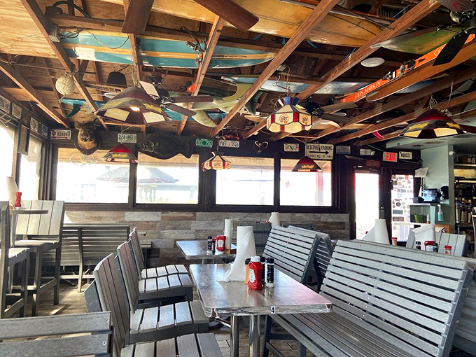 Where license plates meet surfboards on the ceiling&mdash;proof that someone's brilliant decorating philosophy was "more is more."