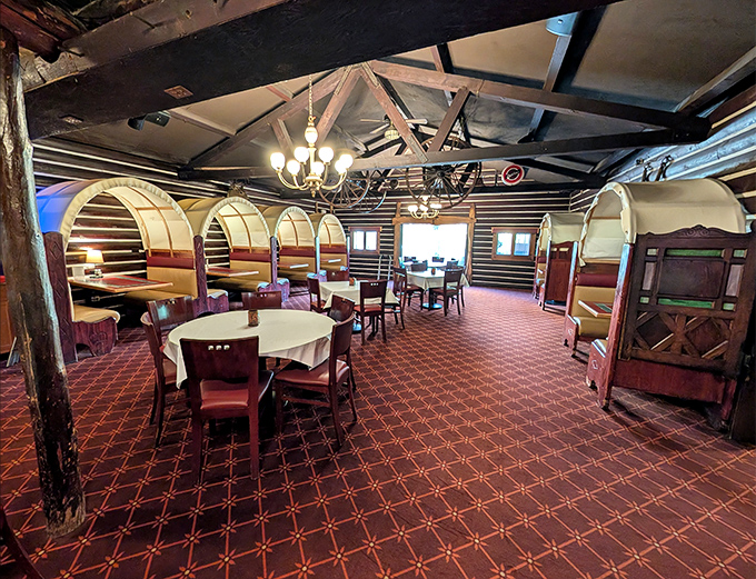 Those curved high-backed booths aren't just seating—they're time machines to when conversation flowed as freely as the cocktails. Classic supper club ambiance at its finest.