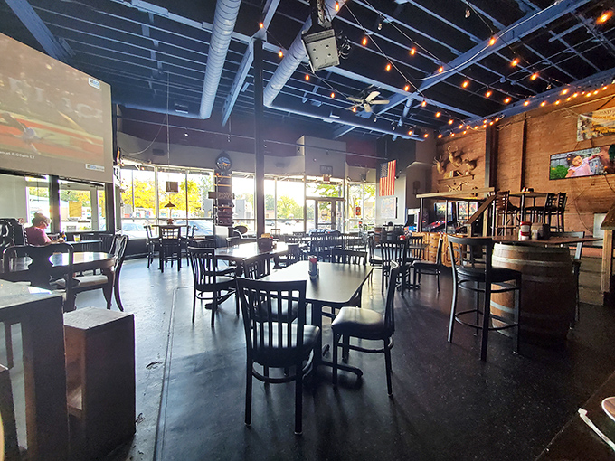 Industrial-chic meets Southern comfort in this airy dining room where string lights create the perfect atmosphere for serious eating.