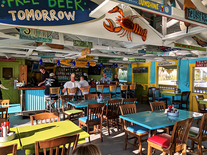 Step inside and the ceiling becomes a maritime museum of witty signs and dangling sea creatures. "Free Beer Tomorrow" might be the oldest promise in restaurant history.