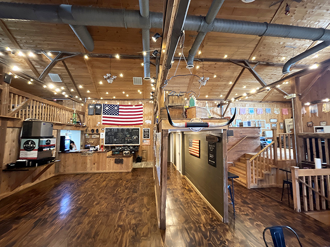 Step inside and the BBQ joint transforms into a rustic wooden cathedral. That American flag isn't just decoration—it's a patriotic promise of authentic American barbecue.