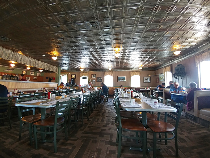 Step inside to discover the restaurant's signature tin ceiling gleaming above green tables where generations of Ohioans have gathered for meals worth remembering.