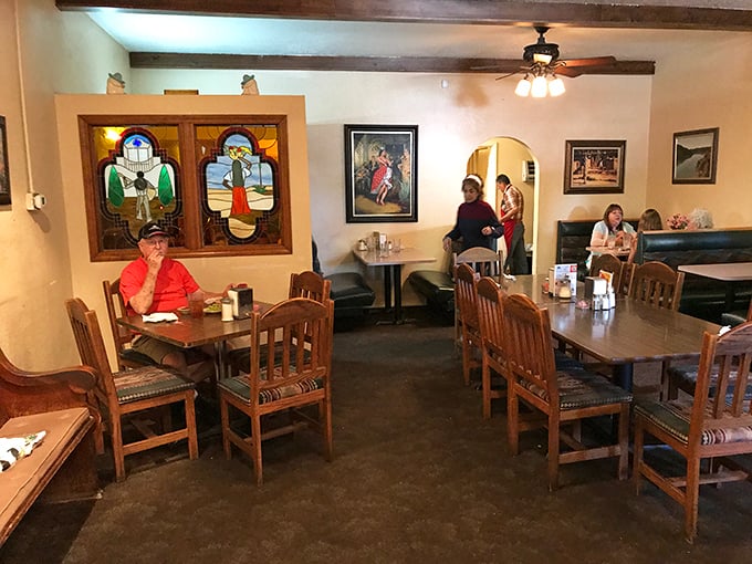 Wooden beams, hanging plants, and sunlight streaming through windows&mdash;this isn't just dining, it's a Lakes Region embrace.