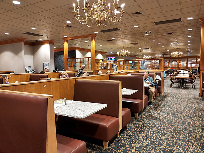 Booths stretch toward the horizon in this dining room where chandeliers add unexpected elegance to a place that takes "all-you-can-eat" as a sacred mission.
