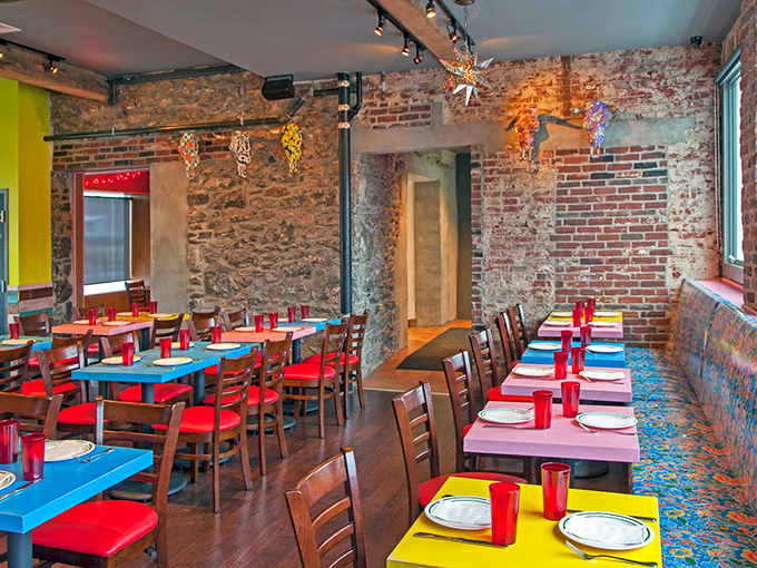 Exposed brick walls meet vibrant primary-colored tables in a space that feels like Mexico's warmest hug transplanted to Pennsylvania soil.