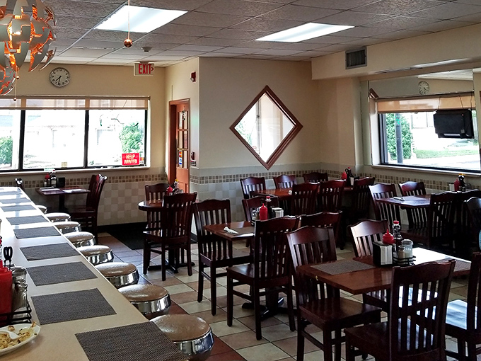 Inside, the classic diner aesthetic with wooden chairs and that distinctive diamond mirror creates the perfect backdrop for breakfast magic.