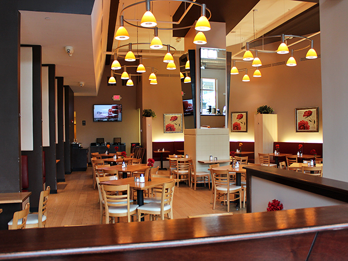 Clean lines, warm woods, and those distinctive pendant lights create an atmosphere where breakfast dreams come true.