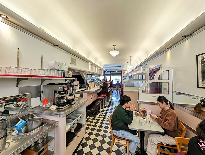Where breakfast dreams come true. The narrow, railroad-style layout with its iconic checkered floor feels like stepping into a delicious time capsule.