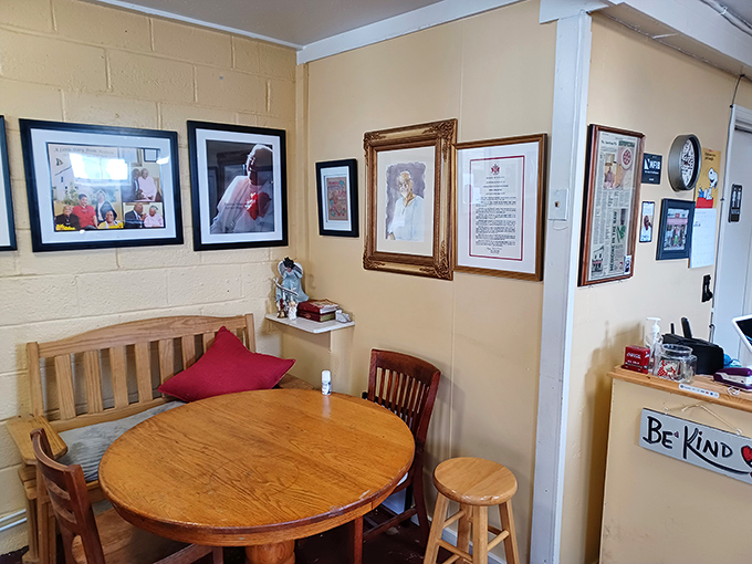 Simple wooden tables, family photos, and a "Be Kind" sign create the kind of authentic charm that billion-dollar restaurant chains try desperately to replicate. 