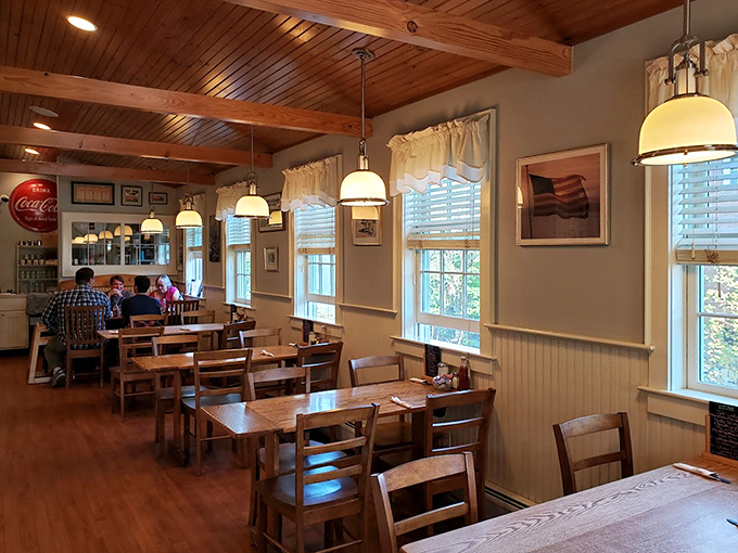 Wooden beams, warm lighting, and simple furnishings create that rare dining space where conversations flow as freely as the coffee.