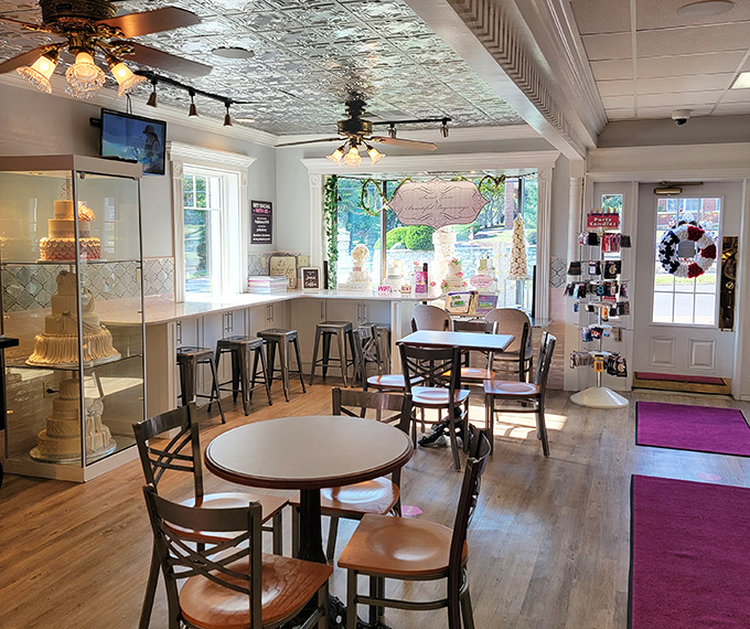 Step inside to discover a cozy haven where vintage-inspired tin ceilings meet modern comfort, creating the perfect backdrop for your sugar-induced euphoria.