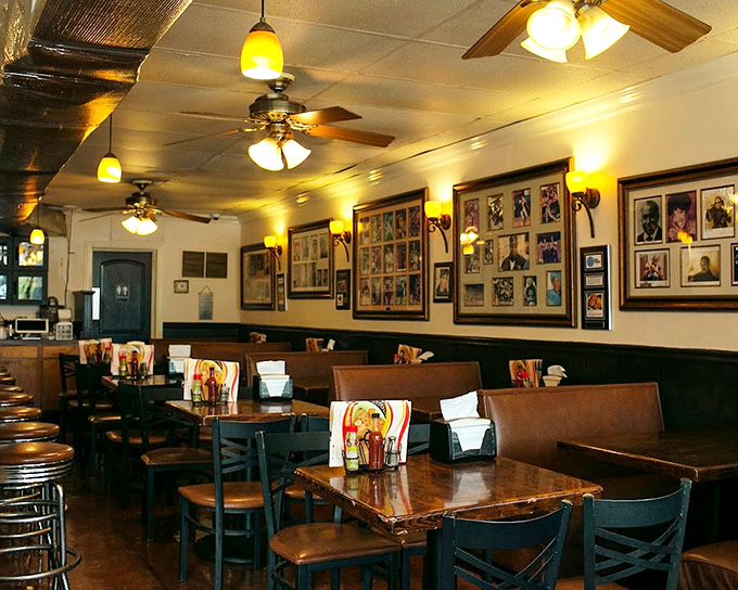 Wall-to-wall history adorns the dining room, where ceiling fans lazily spin above conversations that have spanned generations. Every photo frame tells a story of Atlanta's cultural heritage.