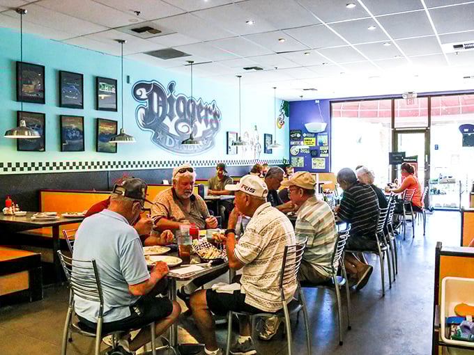 Classic red vinyl booths and wooden tables create that perfect diner atmosphere where conversations flow as freely as the coffee. That longhorn portrait? He's seen some serious pancake consumption.
