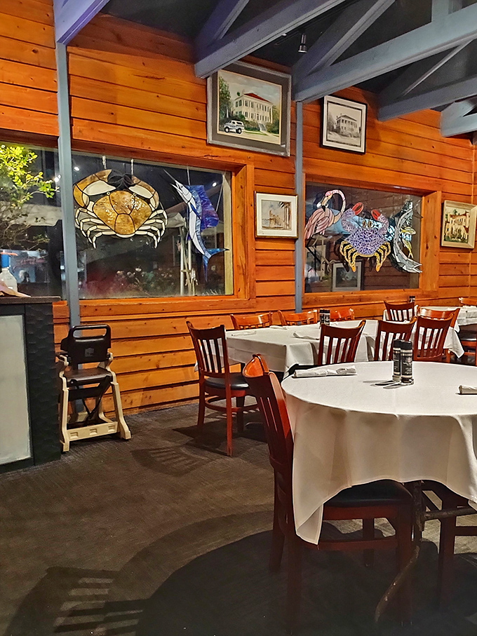 Step inside and the warm wooden interior, adorned with colorful stained glass sea creatures, instantly signals you've found a genuine Florida seafood sanctuary.