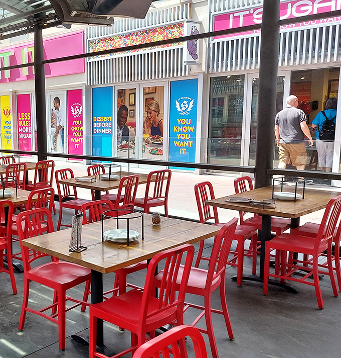 Red chairs pop against wooden tables in this casual oasis. It's like finding your favorite neighborhood joint, except with slot machines nearby.