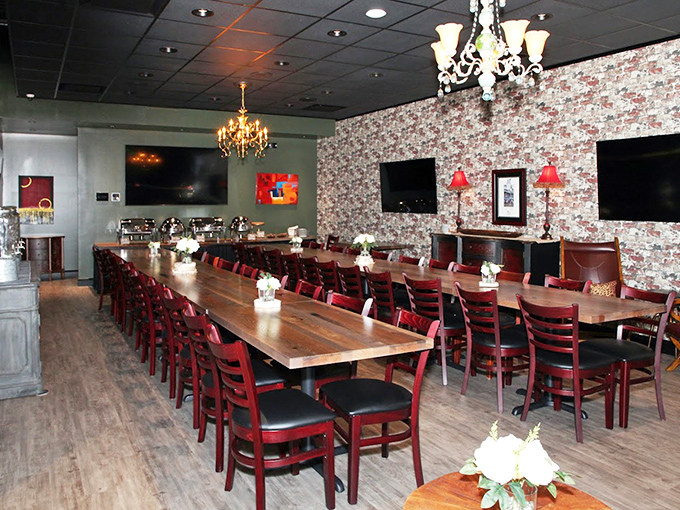 Chandeliers and floral wallpaper meet wooden tables and red chairs&mdash;it's like your stylish grandmother decided to open a barbecue joint.