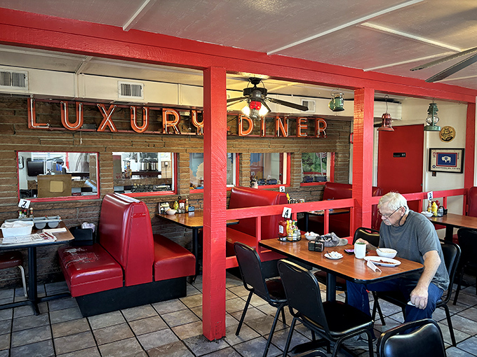 Step inside and the neon glow welcomes you like an old friend. Red vinyl booths&mdash;the kind that have witnessed countless coffee refills and life stories.