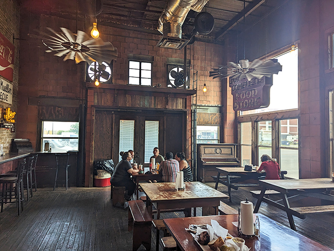 Ceiling fans lazily circulate the intoxicating aroma of smoked meat while diners commune at simple wooden tables. This isn't ambiance by design&mdash;it's authenticity by default.
