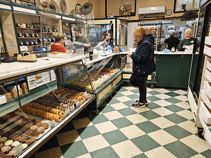 Inside, the checkerboard floor and vintage display cases tell you everything: this place hasn't changed because it hasn't needed to.