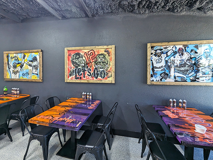 Local sports pride meets smoky satisfaction&mdash;these vibrant tables and Tampa-themed artwork create the perfect backdrop for serious eating.