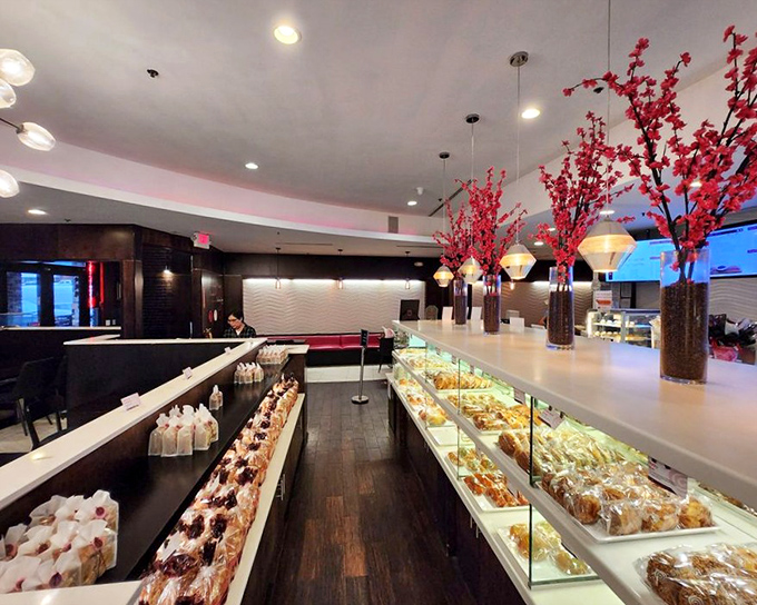 Inside, those cherry blossom arrangements and gleaming display cases transform the space into a modern Asian food paradise.