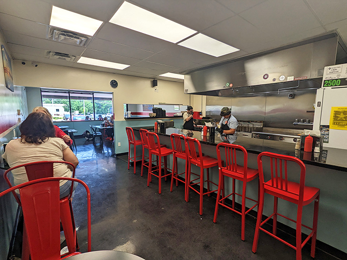Those iconic red counter stools aren't just seating&mdash;they're front-row tickets to the sizzle-and-flip show that makes burger lovers weak in the knees.