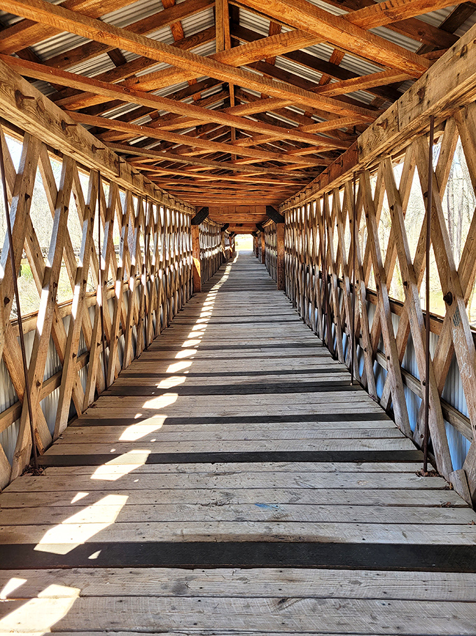 Sunlight plays hide-and-seek through the latticed walls, creating a mesmerizing light show on wooden planks that have witnessed over a century of footsteps.
