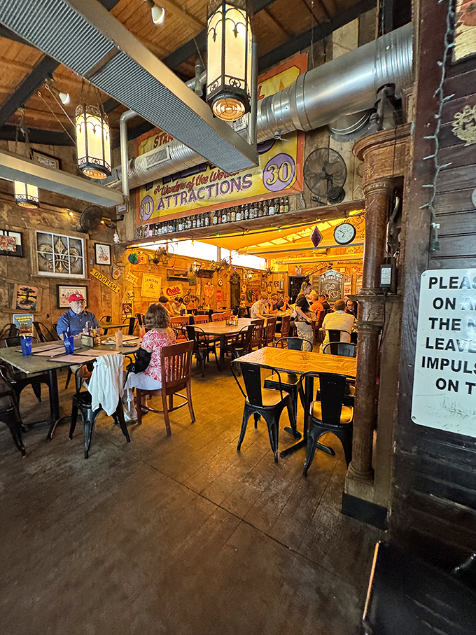 Step inside and the warm glow of hanging lanterns reveals a space where every sticker, sign, and scratch tells a story worth hearing.