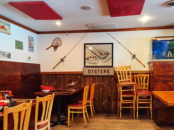 Fishing rods on the wall, "OYSTERS" sign front and center&mdash;this isn't interior decoration, it's a delicious mission statement in wood paneling.