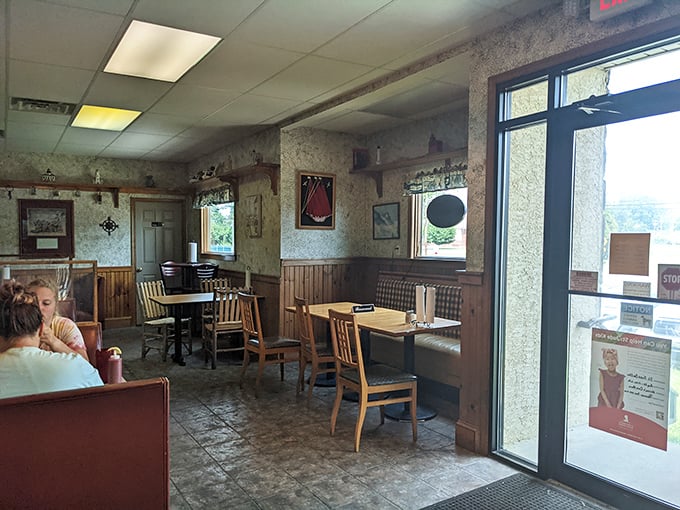 Cozy wooden wainscoting and nautical touches create that perfect "come as you are" vibe where the focus stays squarely on the food.