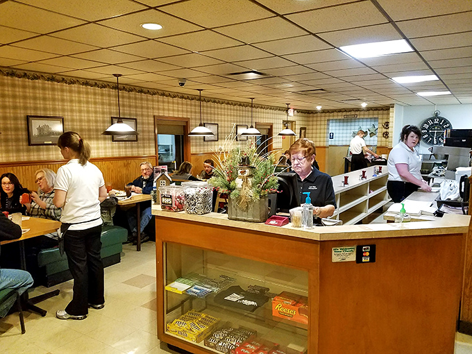 Inside, checkered curtains and wood paneling create that rare atmosphere where calories don't count and conversations flow as freely as the coffee.