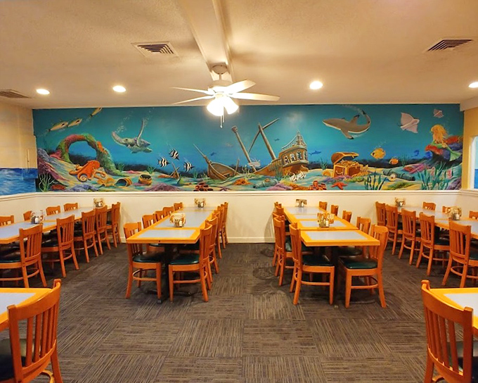 The underwater mural transforms dining into an oceanic adventure. Who needs a submarine when you've got comfortable chairs and no chance of getting wet?