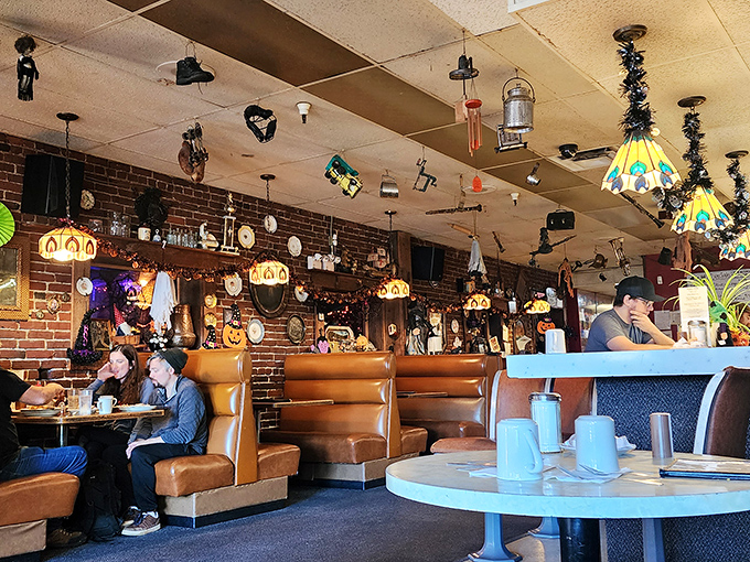 Tiffany lamps dangle from a ceiling festooned with curiosities while caramel-colored booths cradle generations of Portlanders. This isn't d&eacute;cor&mdash;it's a living museum of comfort.