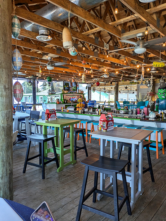The Sandbar's eclectic ceiling decorations create an atmosphere somewhere between beach party and nautical treasure hunt, and we're absolutely here for it.