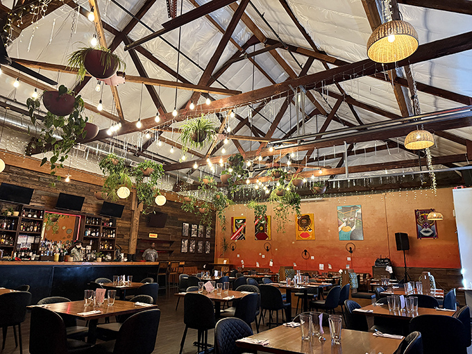 High ceilings, hanging plants, and warm lighting create the perfect atmosphere for a culinary adventure &ndash; part industrial chic, part tropical oasis.