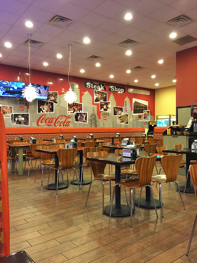 Inside, the vibrant red and yellow walls create a warm atmosphere where memories are made between bites of legendary cheesesteaks.
