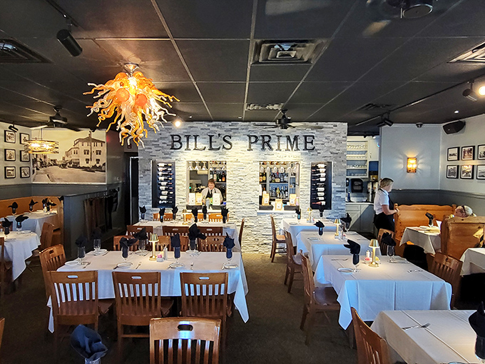 That amber glass chandelier isn't just lighting the dining room—it's setting the mood for the seafood symphony that's about to play on your palate.