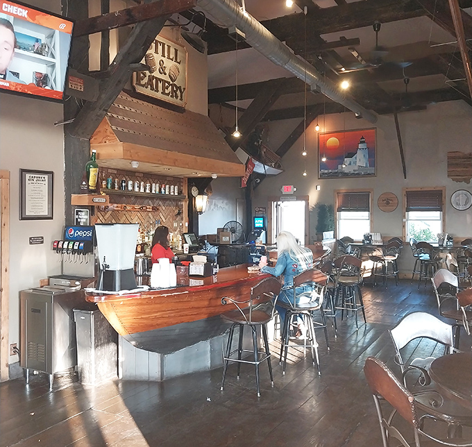 The star of the show: a genuine wooden boat transformed into a bar. Nautical dreams and whiskey realities meet under rustic wooden beams.