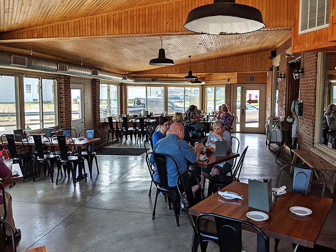 Wooden ceilings, natural light, and comfortable seating create that perfect "where everybody knows your name" atmosphere.