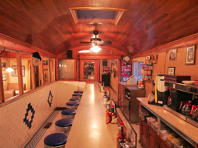 Step inside and time travel begins. This authentic dining car's wood-paneled interior and counter seating whisper stories from decades of satisfied diners.