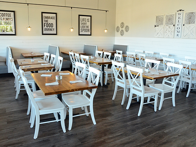 Clean lines, farmhouse chic, and inspirational food quotes create the perfect backdrop for morning indulgence. The "lick the spoon" philosophy is alive and well here.